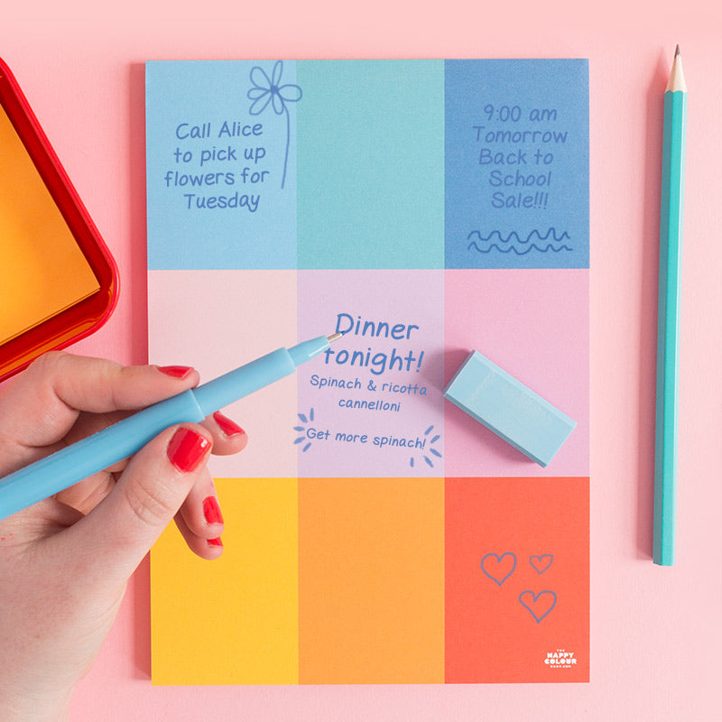 colourful-square-grid-notepad-a5-the-happy-colour-shop-flatlay-on-pink ...
